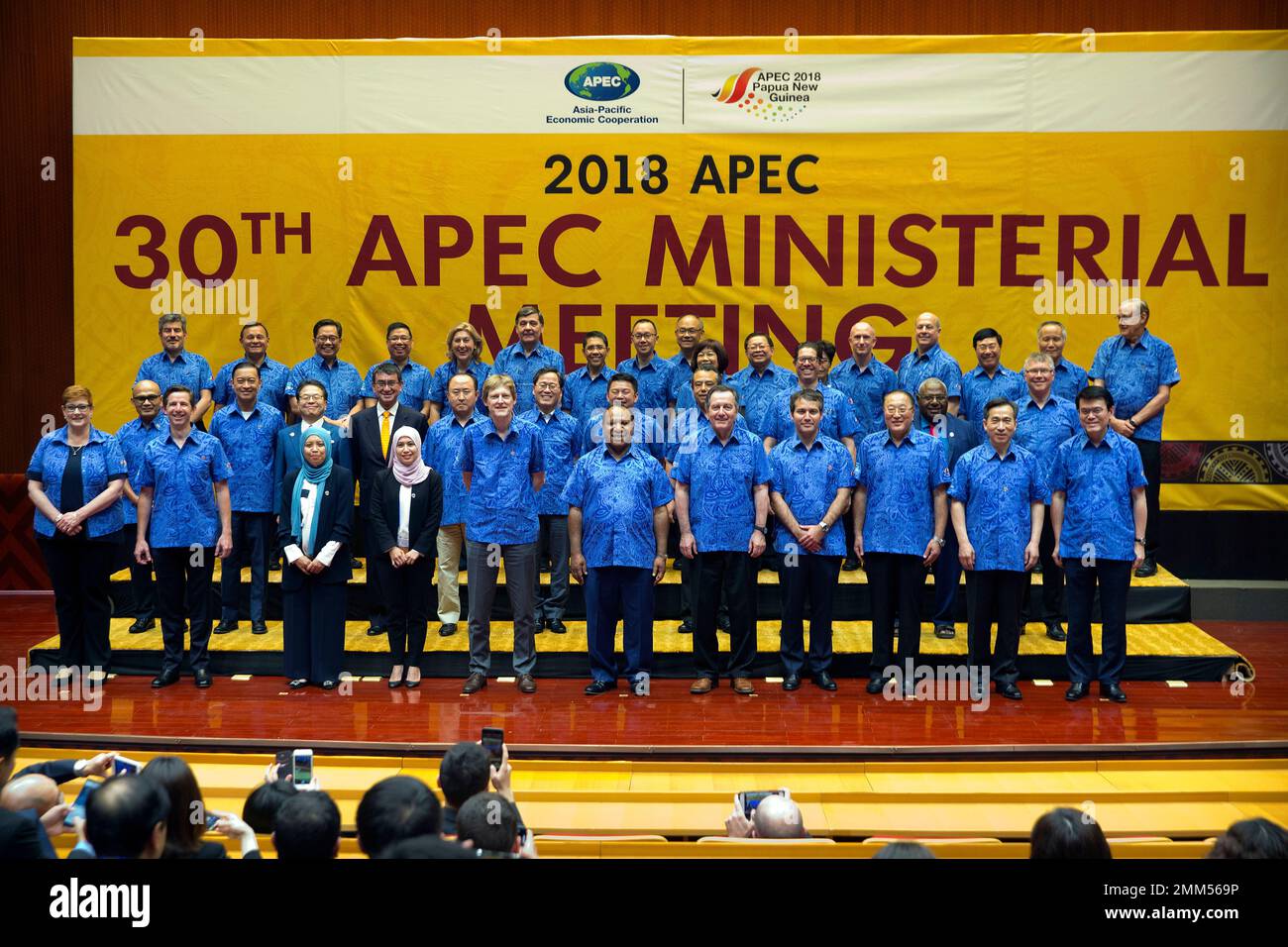 Ministers pose for a group photo during the APEC Ministerial Meeting at the International ...