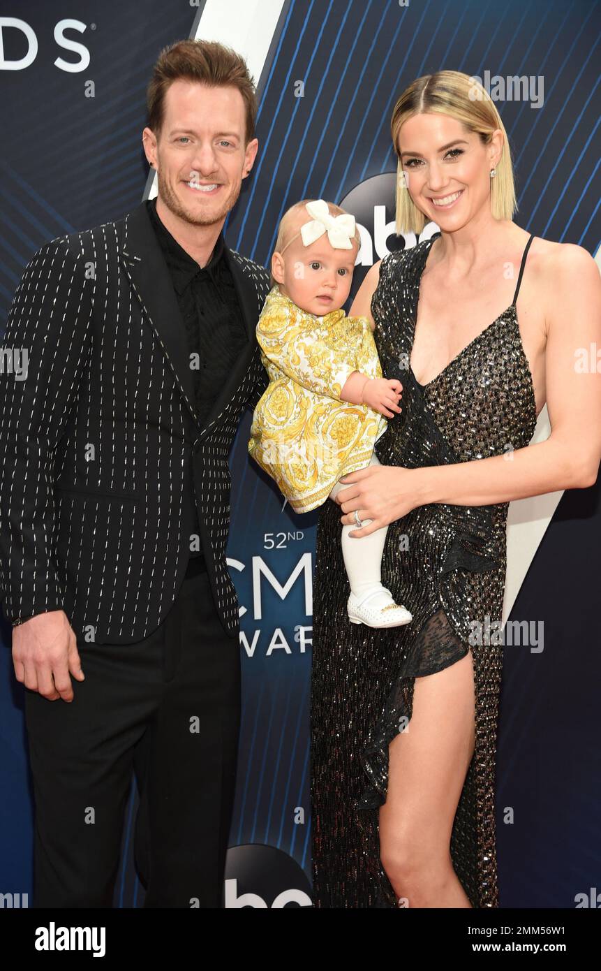 Tyler Hubbard, left, and Hayley Stommel arrive at the 52nd annual CMA ...