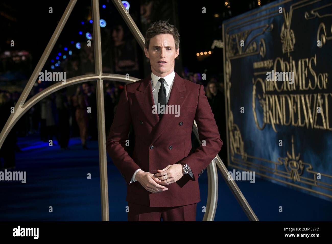 Actor Eddie Redmayne poses for photographers upon arrival at the ...