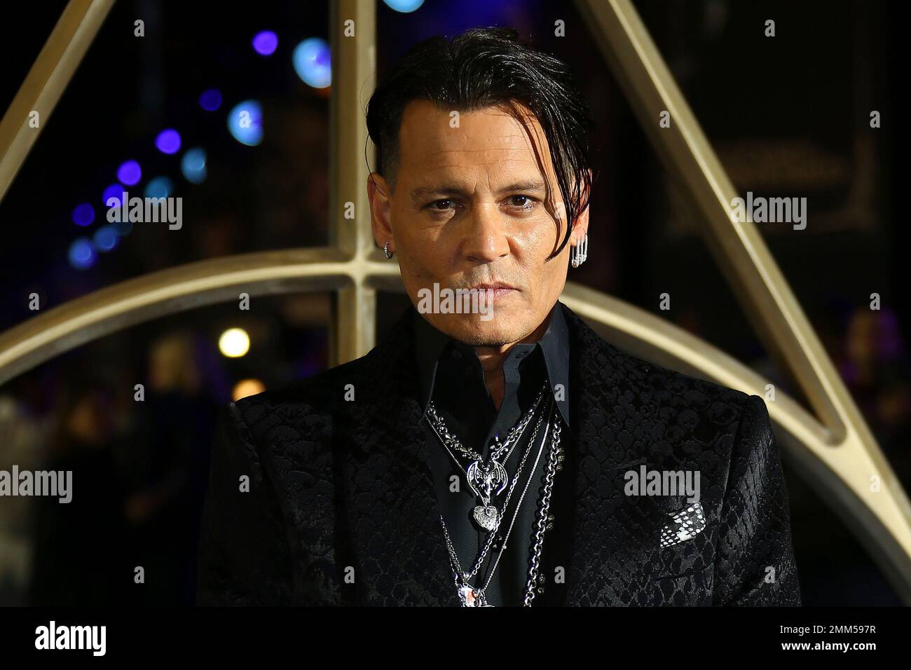 Actor Johnny Depp poses for photographers upon arrival at the premiere ...