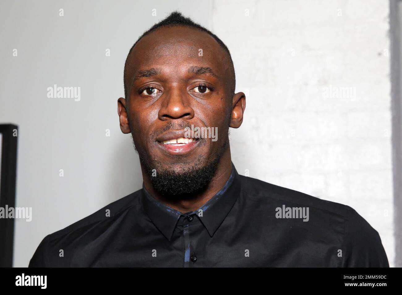Athlete Usain Bolt poses for a photograph during an interview marking ...