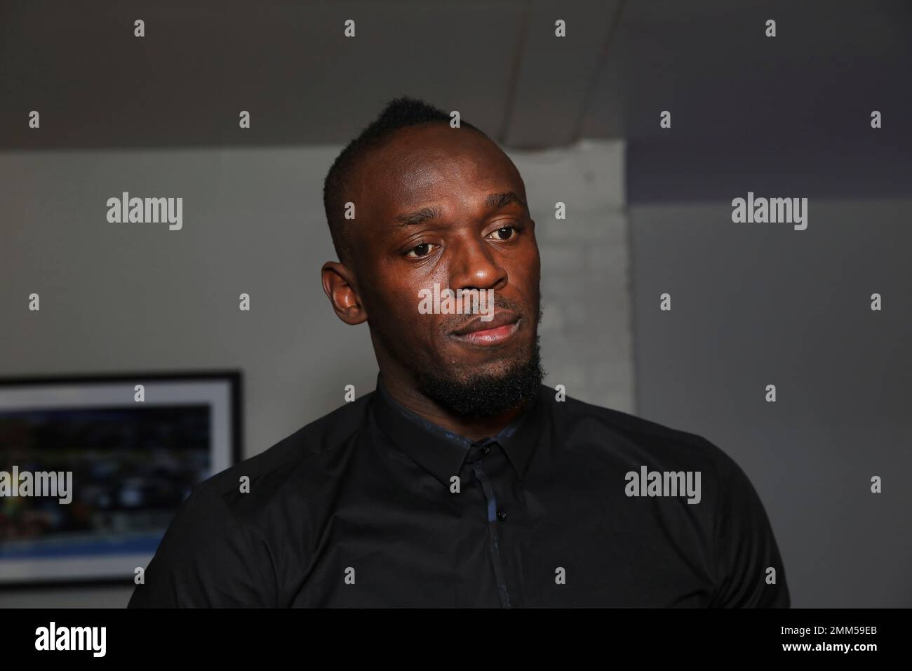 Athlete Usain Bolt poses for a photograph during an interview marking ...