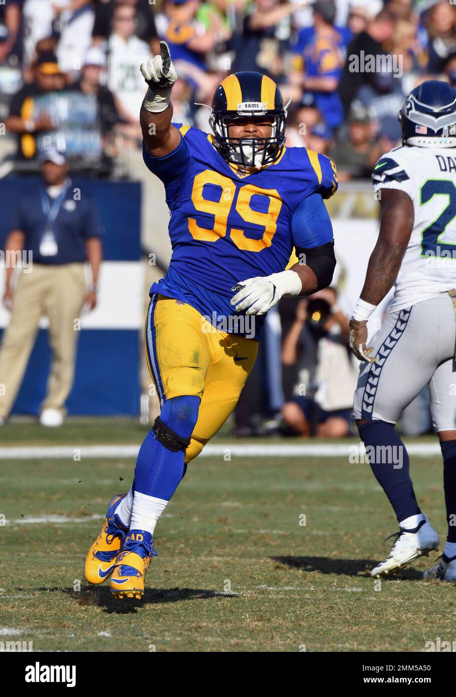 Los Angeles Rams defensive tackle Aaron Donald (99) reacts after making ...