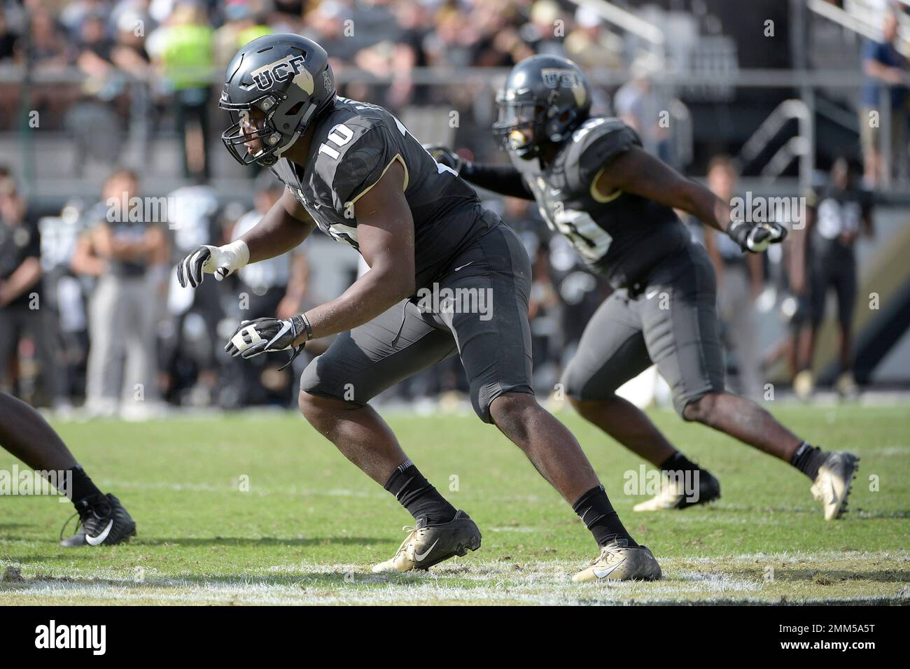 Central Florida defensive lineman Titus Davis (10) sets up for a play ...