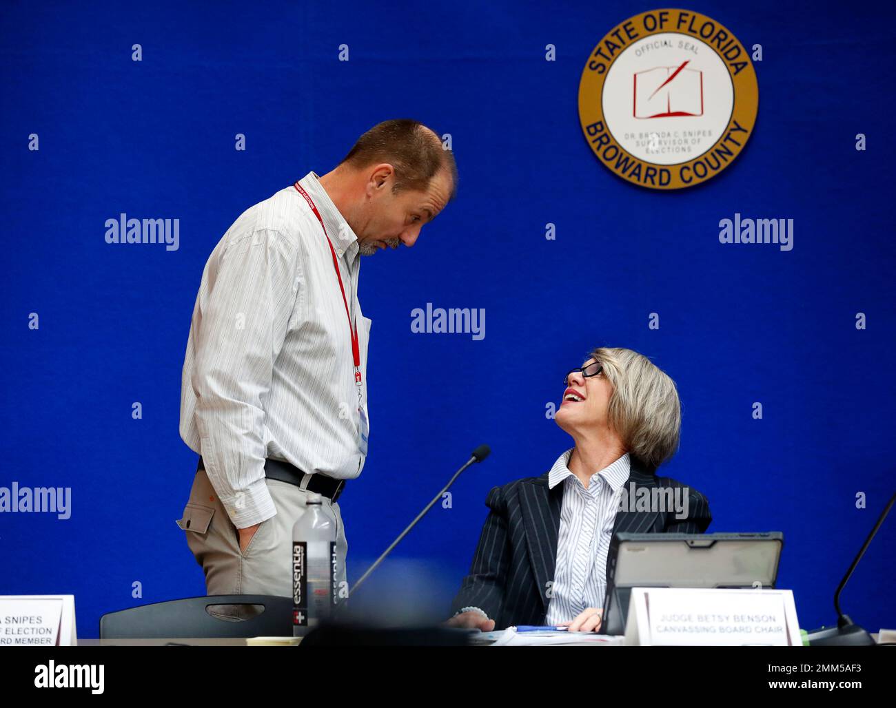 Canvassing Board chair Judge Betsy Benson, right, talks with Joe D ...