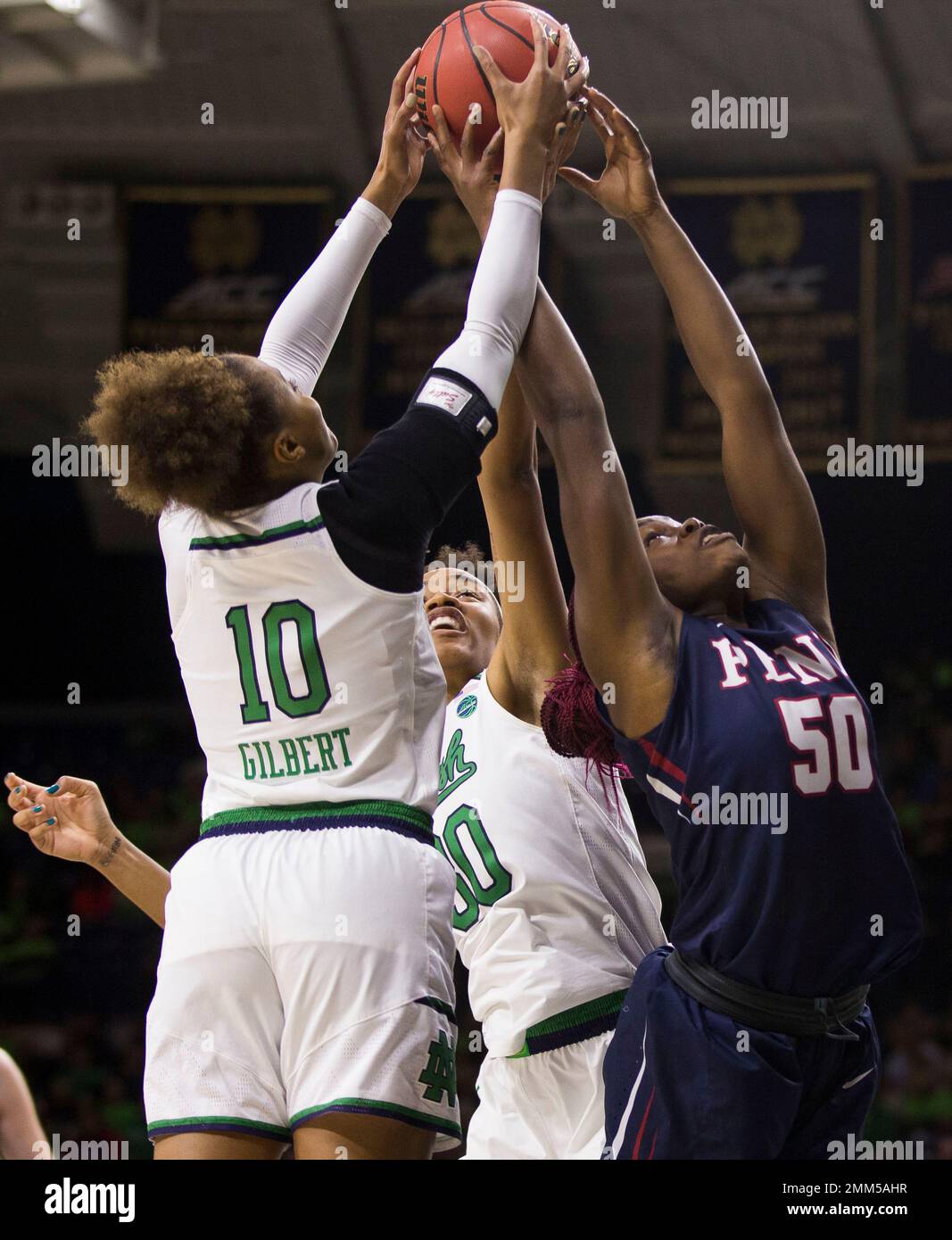 Pennsylvania's Princess Aghayere (50) competes for a rebound with Notre ...