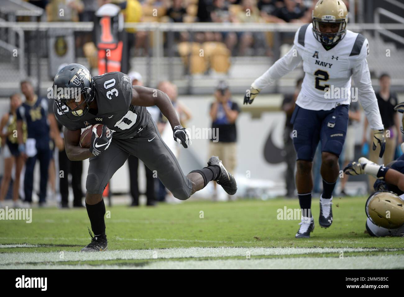 Central Florida running back Greg McCrae (30) scores an 11-yard rushing ...