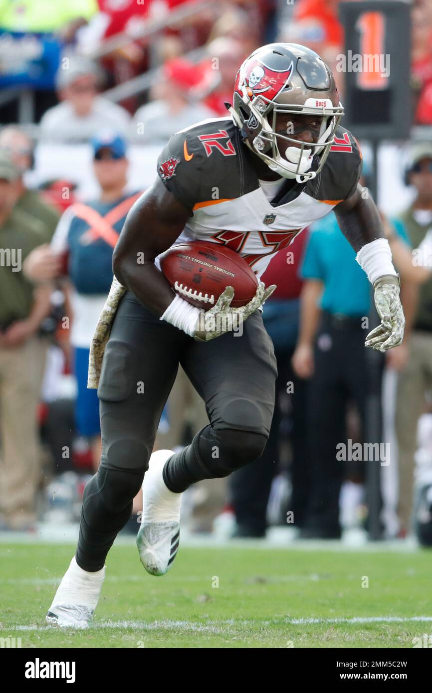 Tampa Bay Buccaneers wide receiver Chris Godwin (12) runs with the ball ...