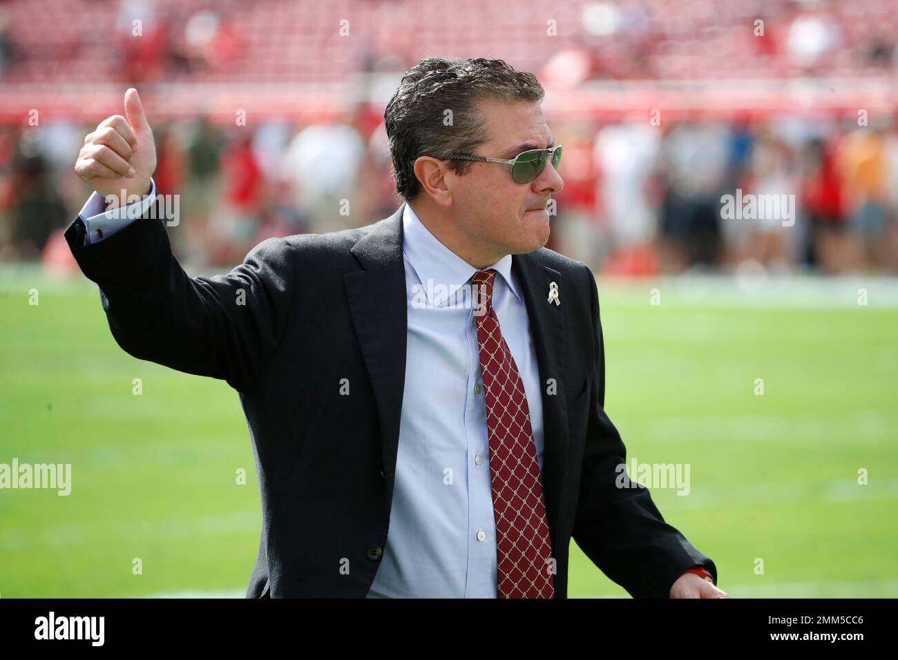Washington Redskins owner Daniel Snyder walks the sidelines before an ...