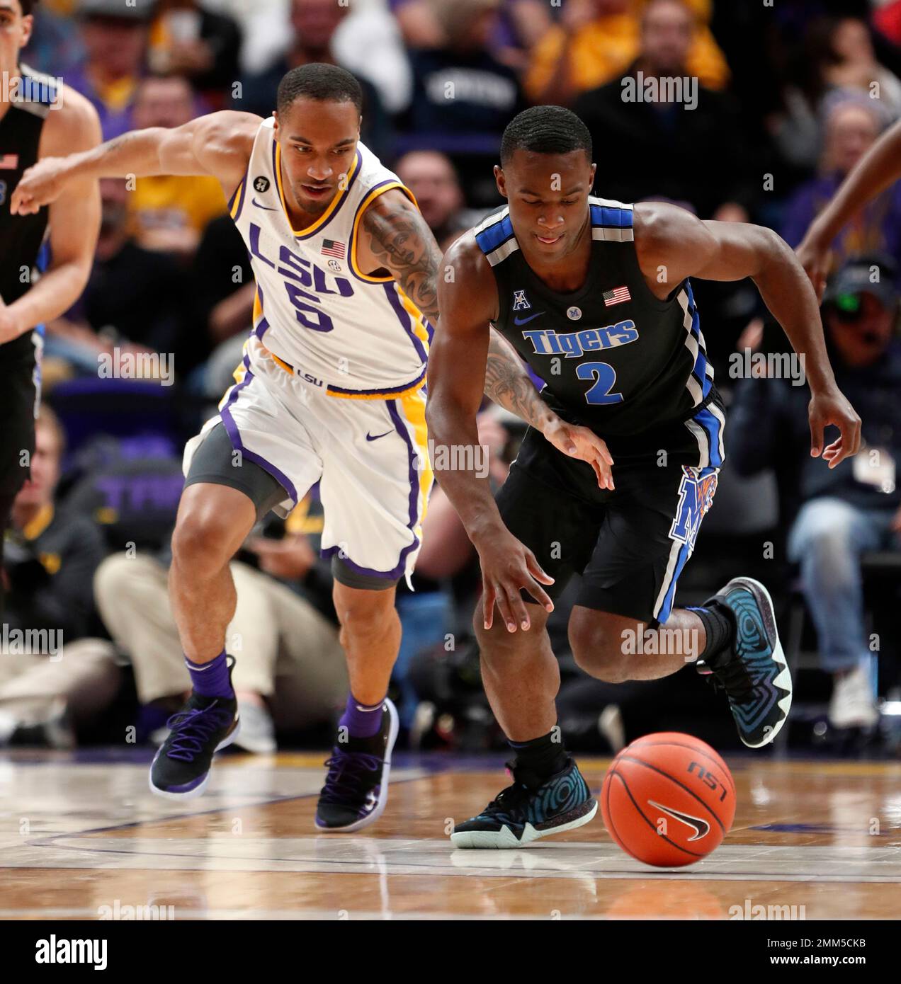 LSU guard Daryl Edwards (5) and Memphis guard Alex Lomax (2) chase down ...