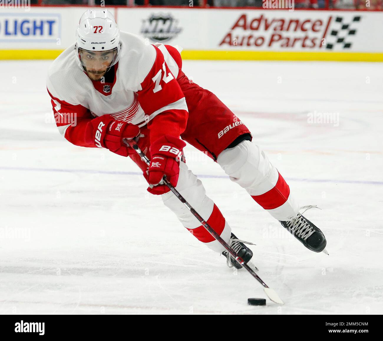 Detroit Red Wings' Andreas Athanasiou (72) moves the puck against the ...