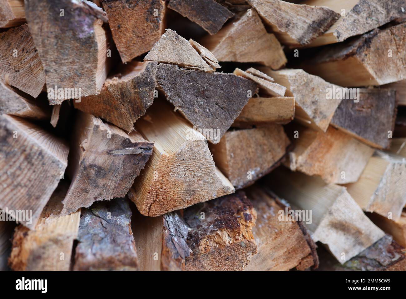 Many chopped firewood as background Stock Photo - Alamy