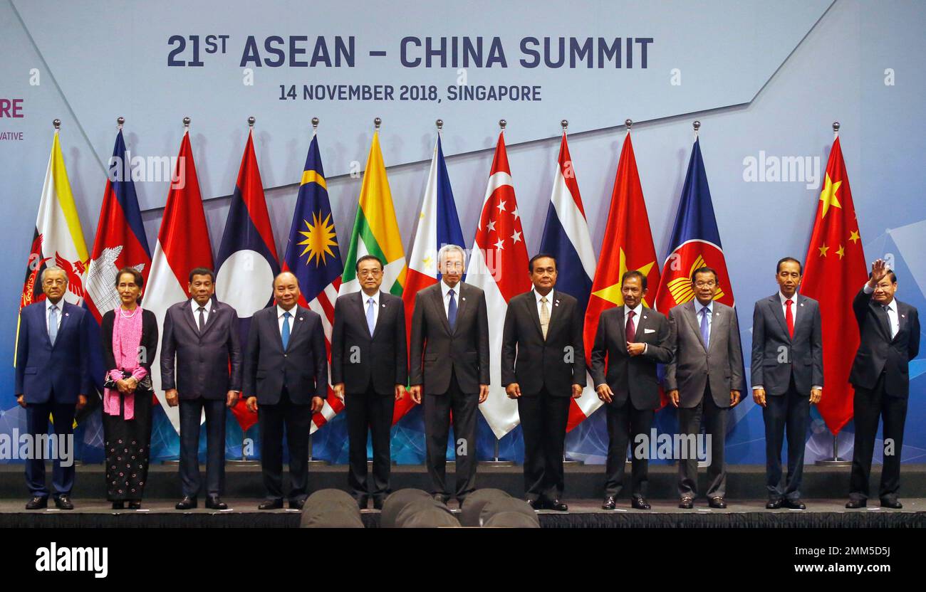 Chinese Premier Li Keqiang, fifth from left, poses for a group photo ...