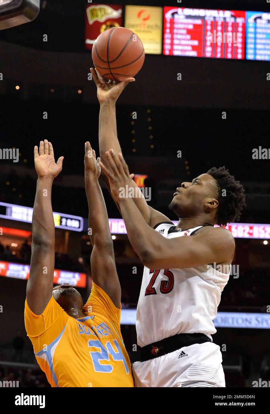 Louisville center Steven Enoch (23) goes in for a layup over Southern ...