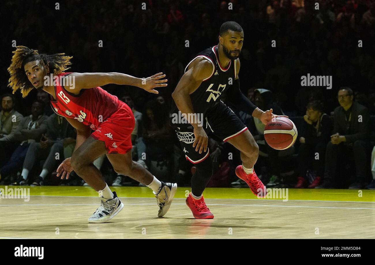 London Lions' Jordan Taylor drives past Leicester Riders' Conner ...