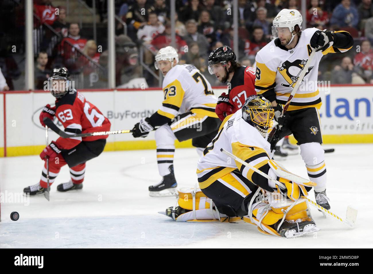A shot by New Jersey Devils defenseman Damon Severson, not pictured ...
