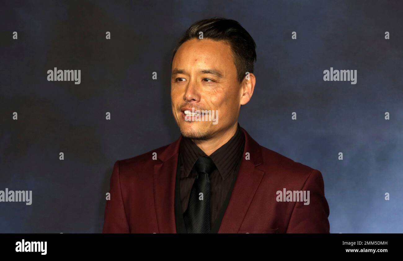Actor SImon Wan poses for photographers on arrival at the premiere of ...