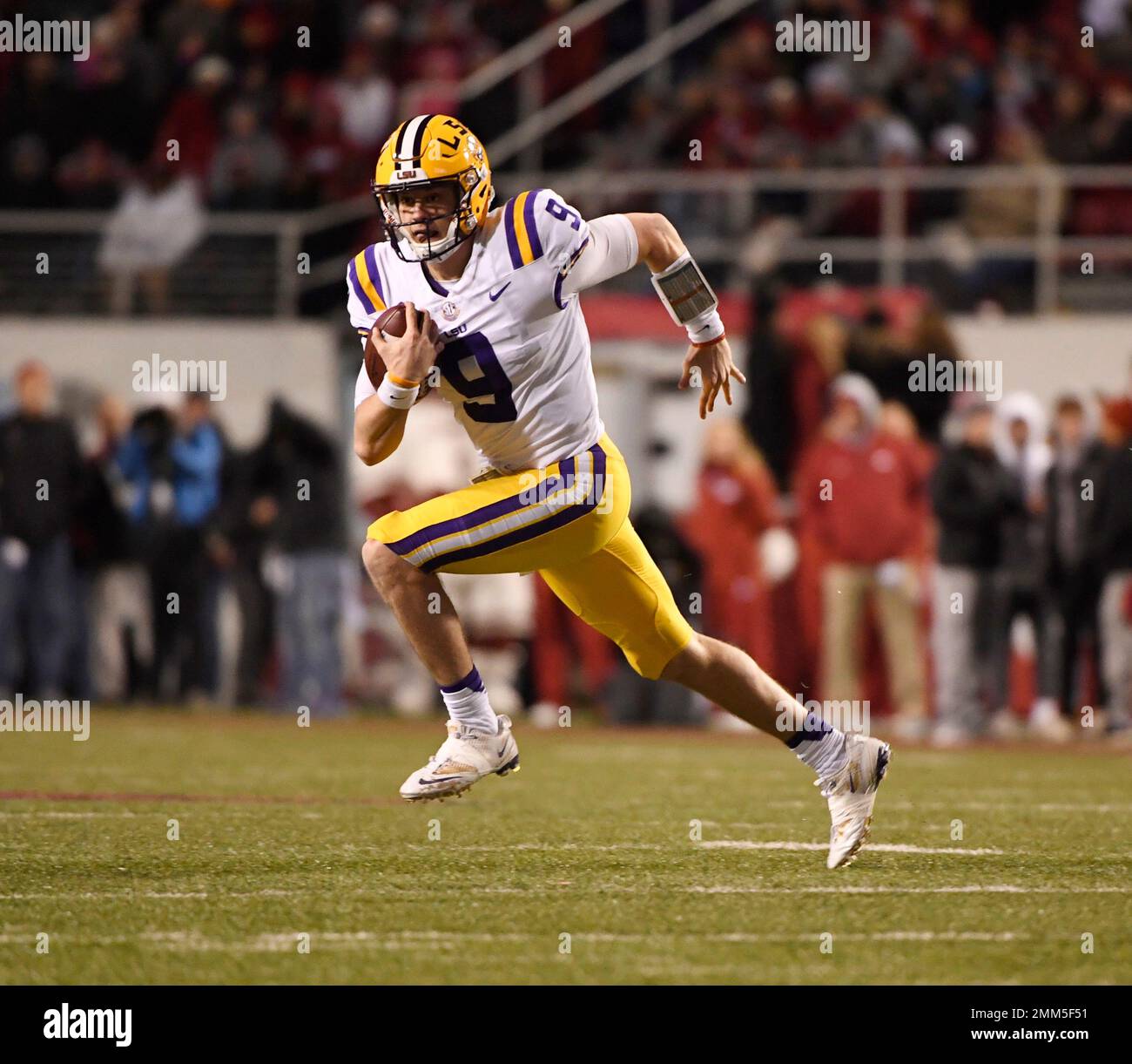 LSU quarterback Joe Burrow runs the ball against Arkansas during the ...