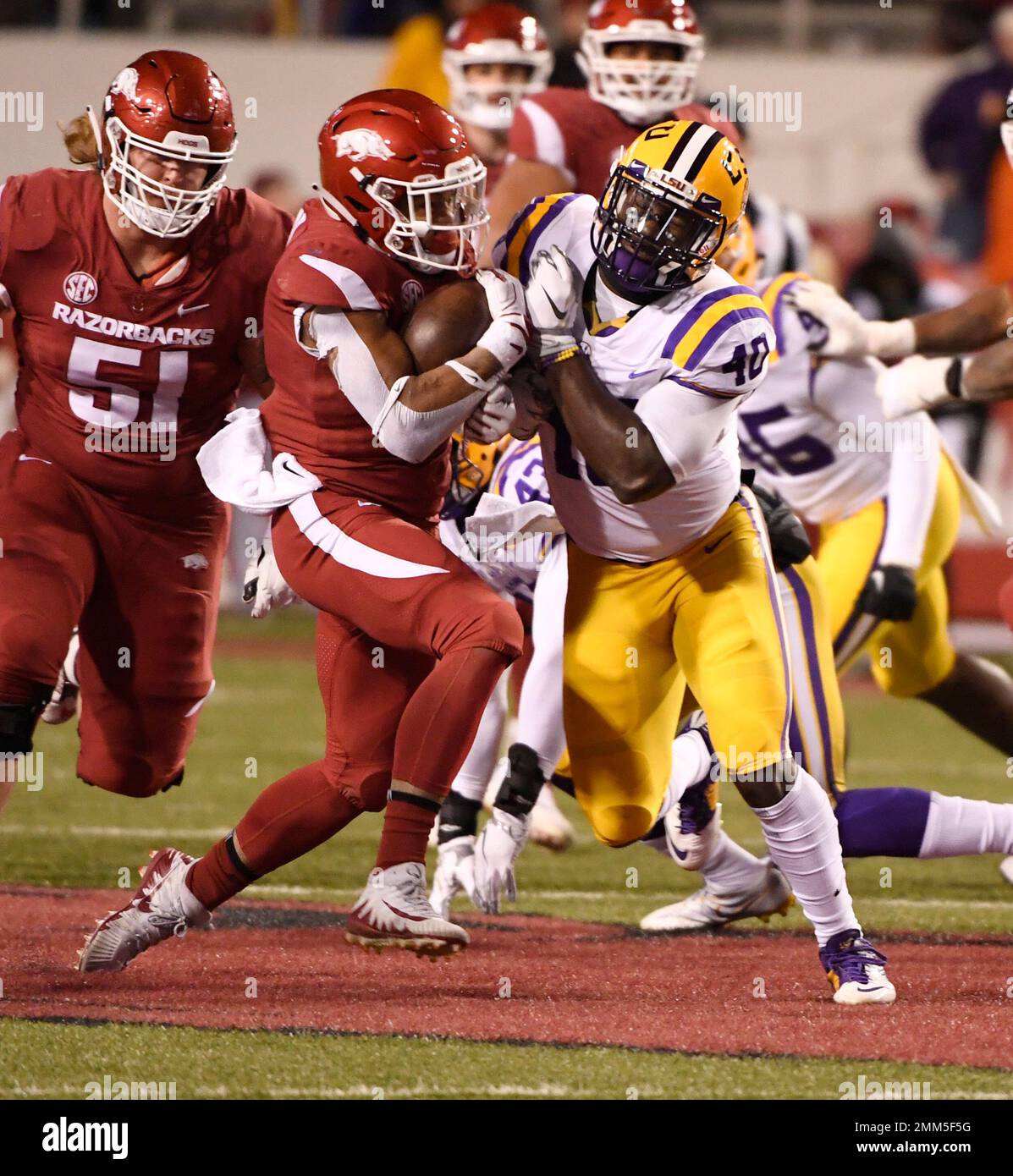 Arkansas running back Rakeem Boyd is tackled by LSU defender Devin ...