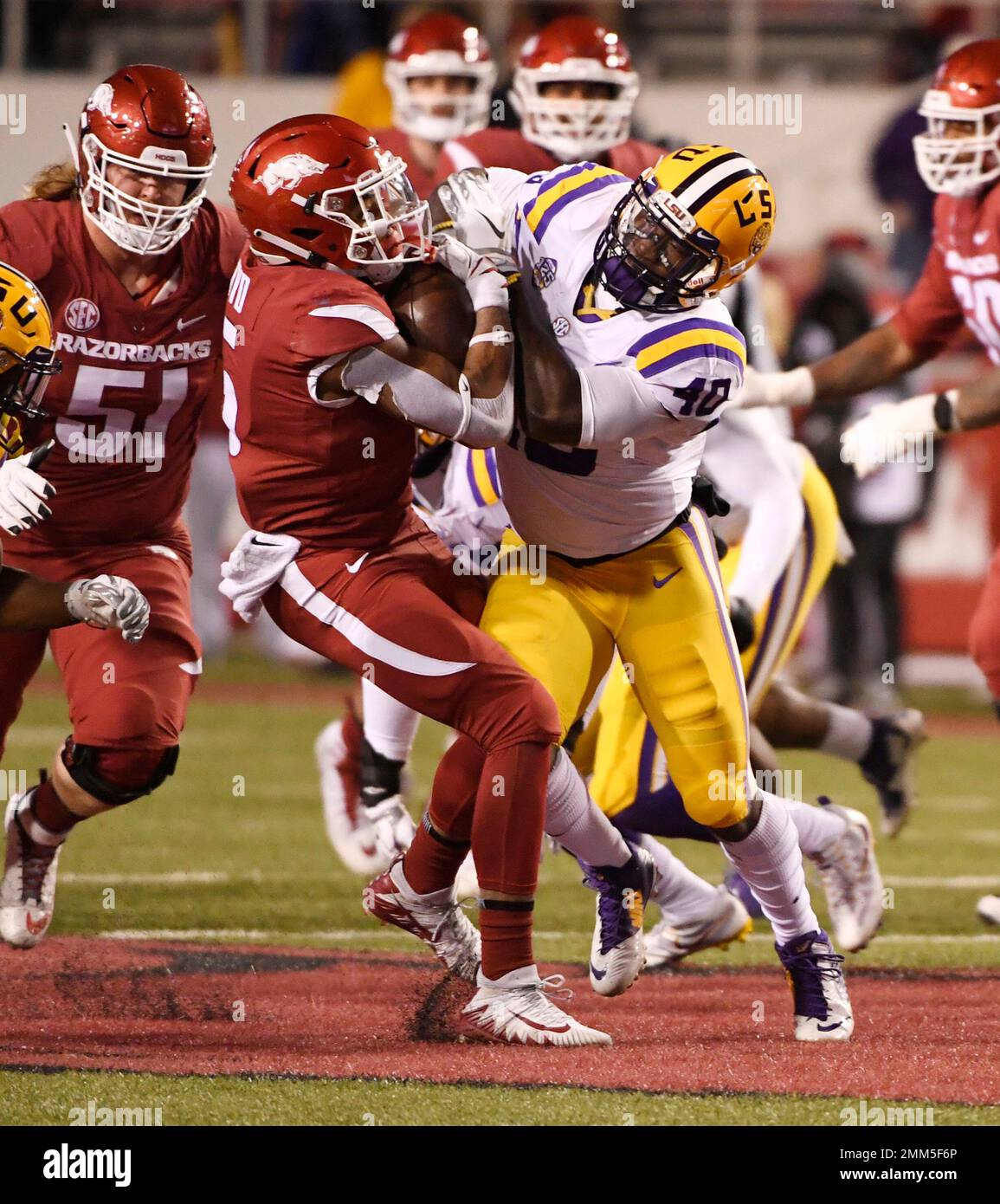 Arkansas running back Rakeem Boyd is tackled by LSU defender Devin ...