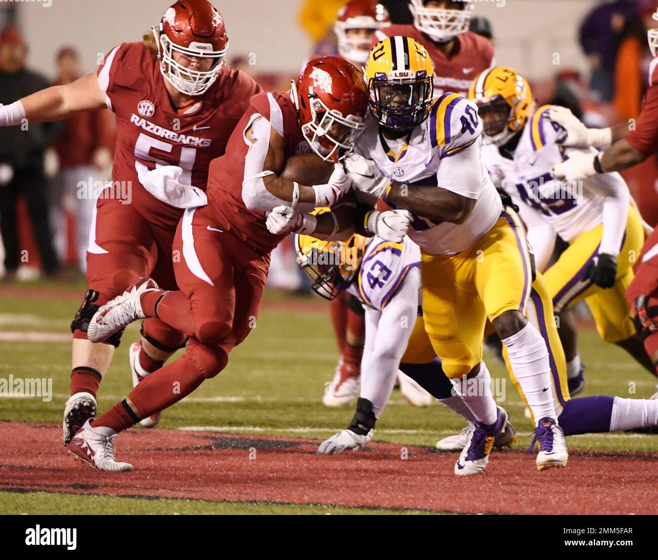 Arkansas running back Rakeem Boyd is tackled by LSU defender Devin ...