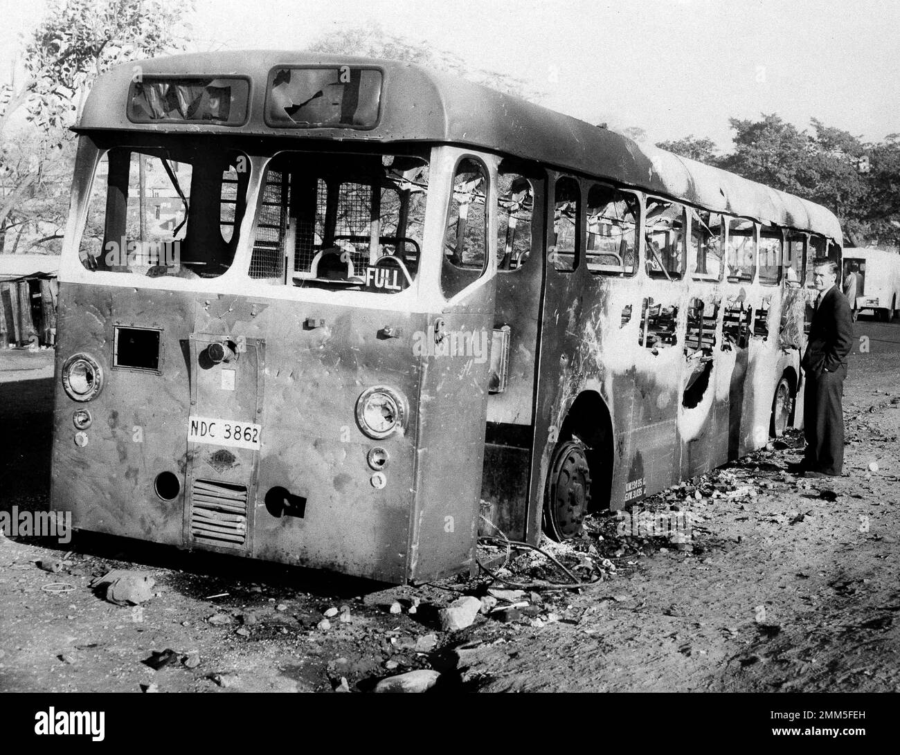 The gutted hulk of a municipal bus lies in the Cato Manor section of ...