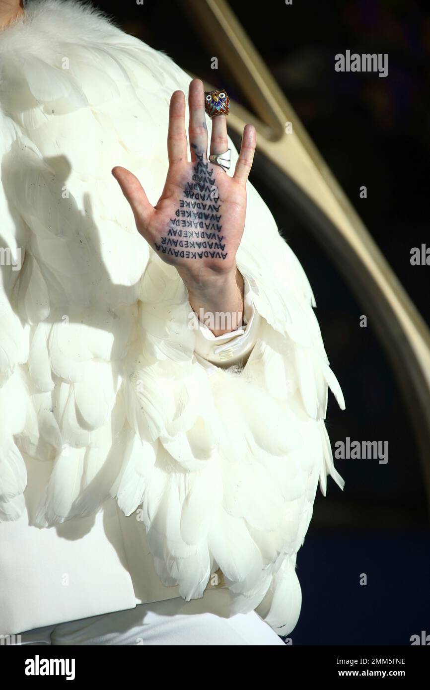 Actor Ezra Miller poses for photographers upon arrival at the premiere ...