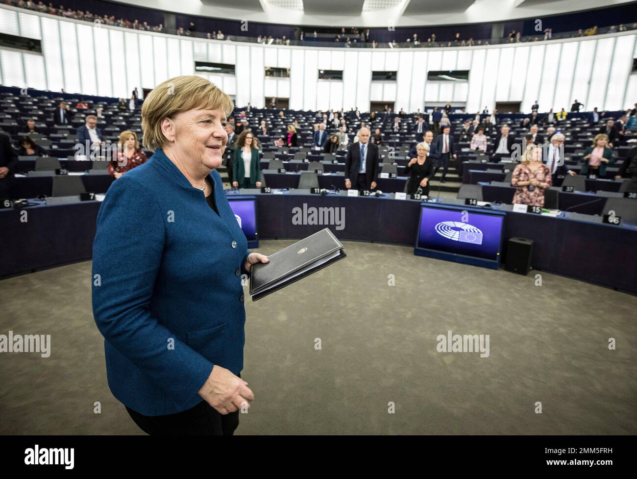 German Chancellor Angela Merkel leaves after debating the future of ...