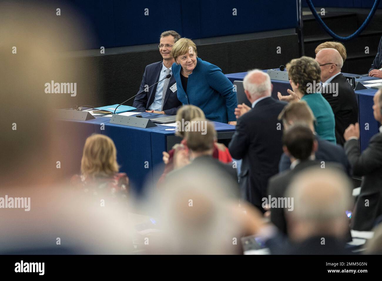 German Chancellor Angela Merkel sits as she arrives to debate the ...
