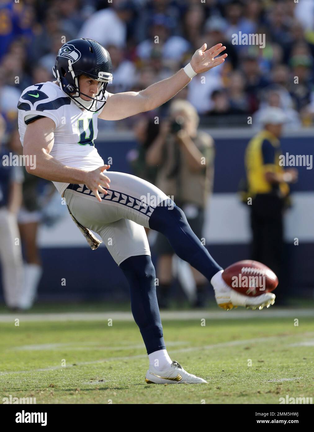 Seattle Seahawks punter Michael Dickson (4) punts the ball downfield ...