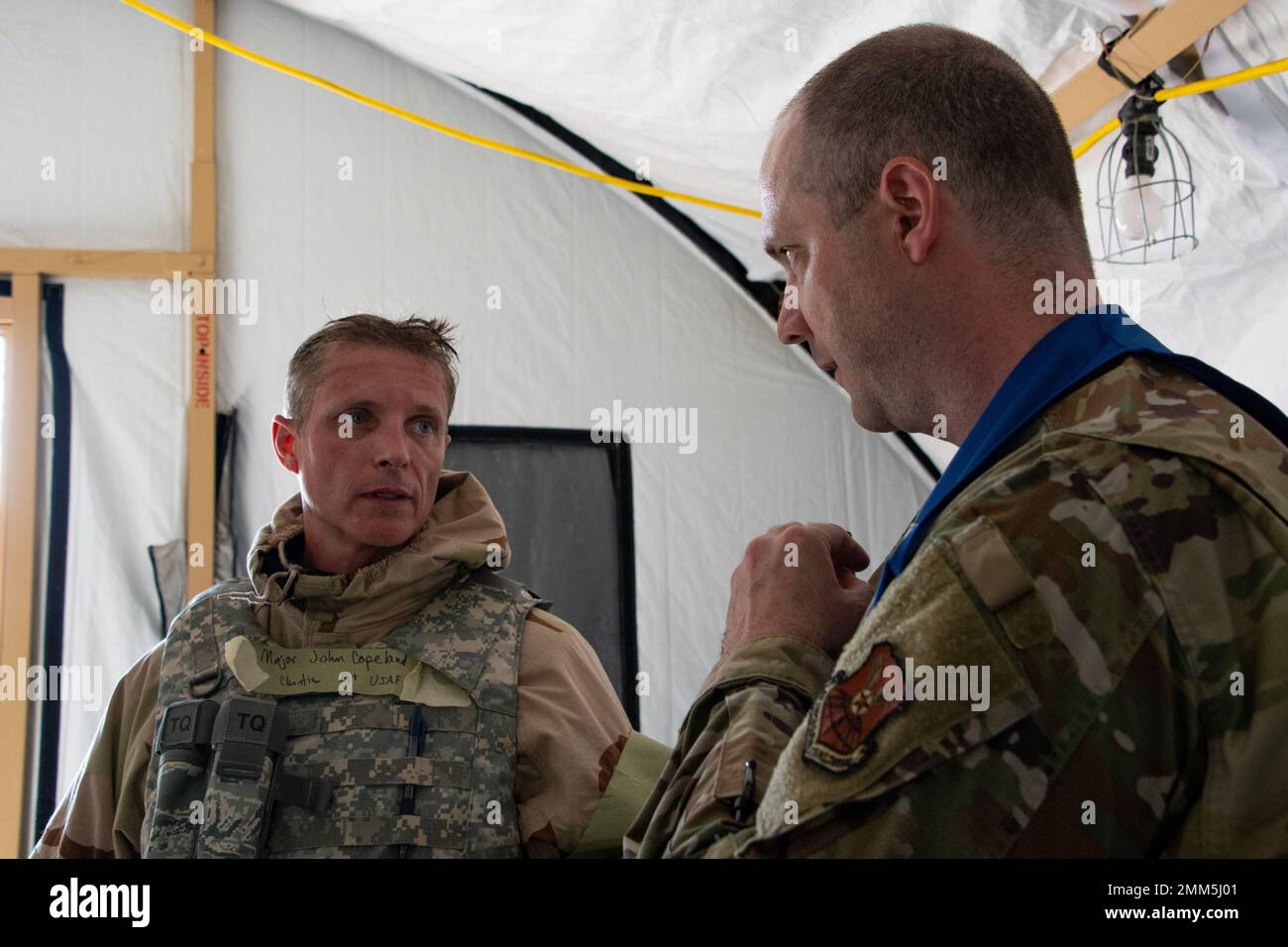 U.S Air Force Maj. John Copeland, 509th Bomb Wing flight medical member, is inspected by Maj ...