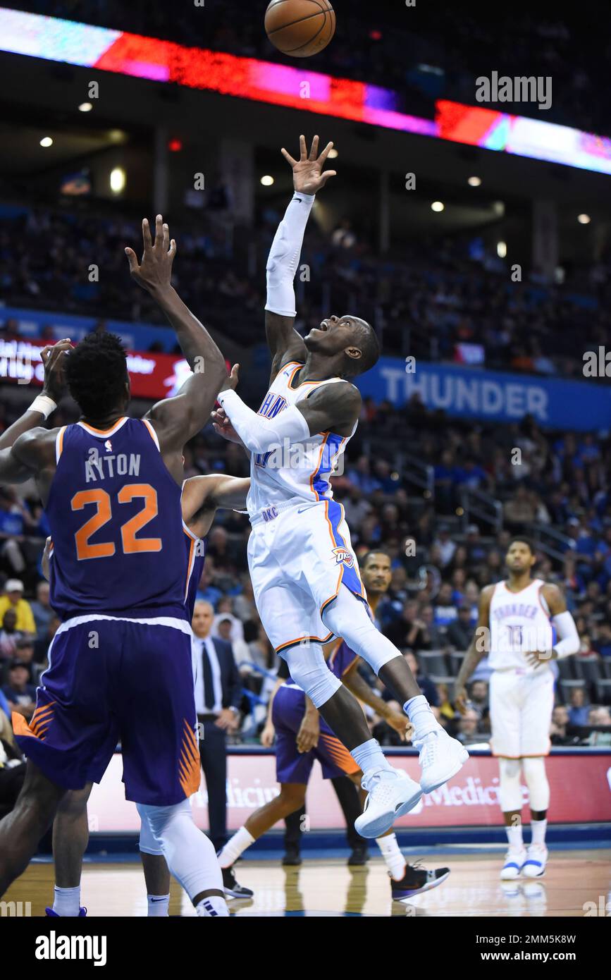 Oklahoma City Thunder guard Dennis Schroder (17) goes up for a shot ...