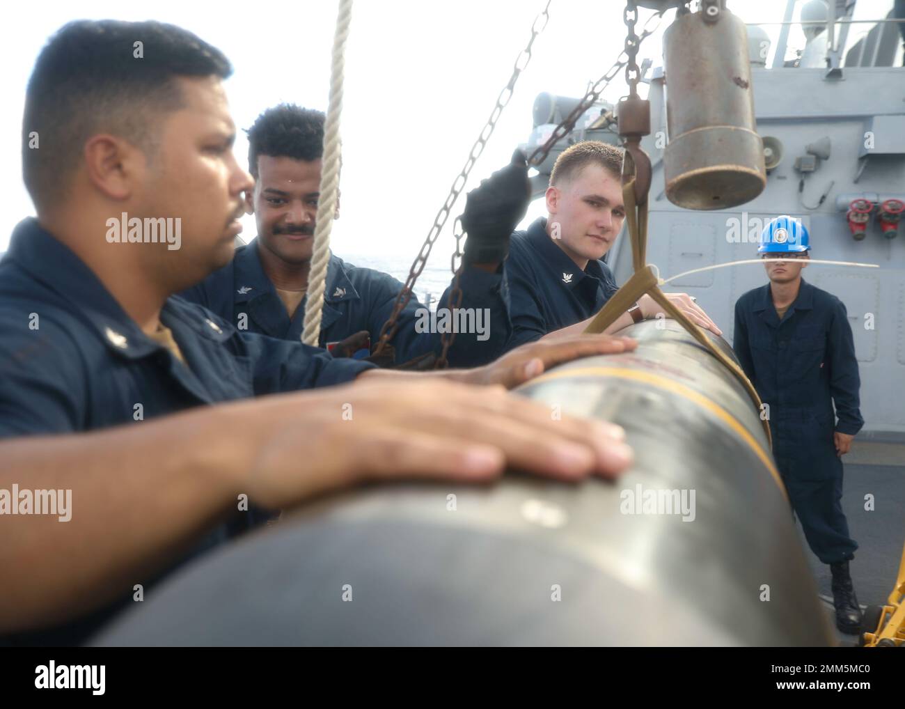 PHILIPPINE SEA (Sep. 14, 2022) Sailors move a torpedo on the aft ...