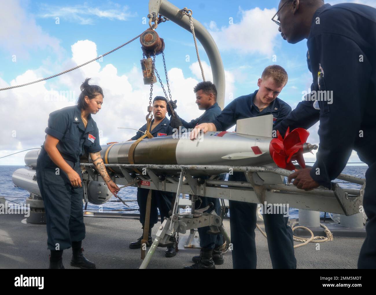 PHILIPPINE SEA (Sep. 14, 2022) Sailors load a torpedo on the aft ...