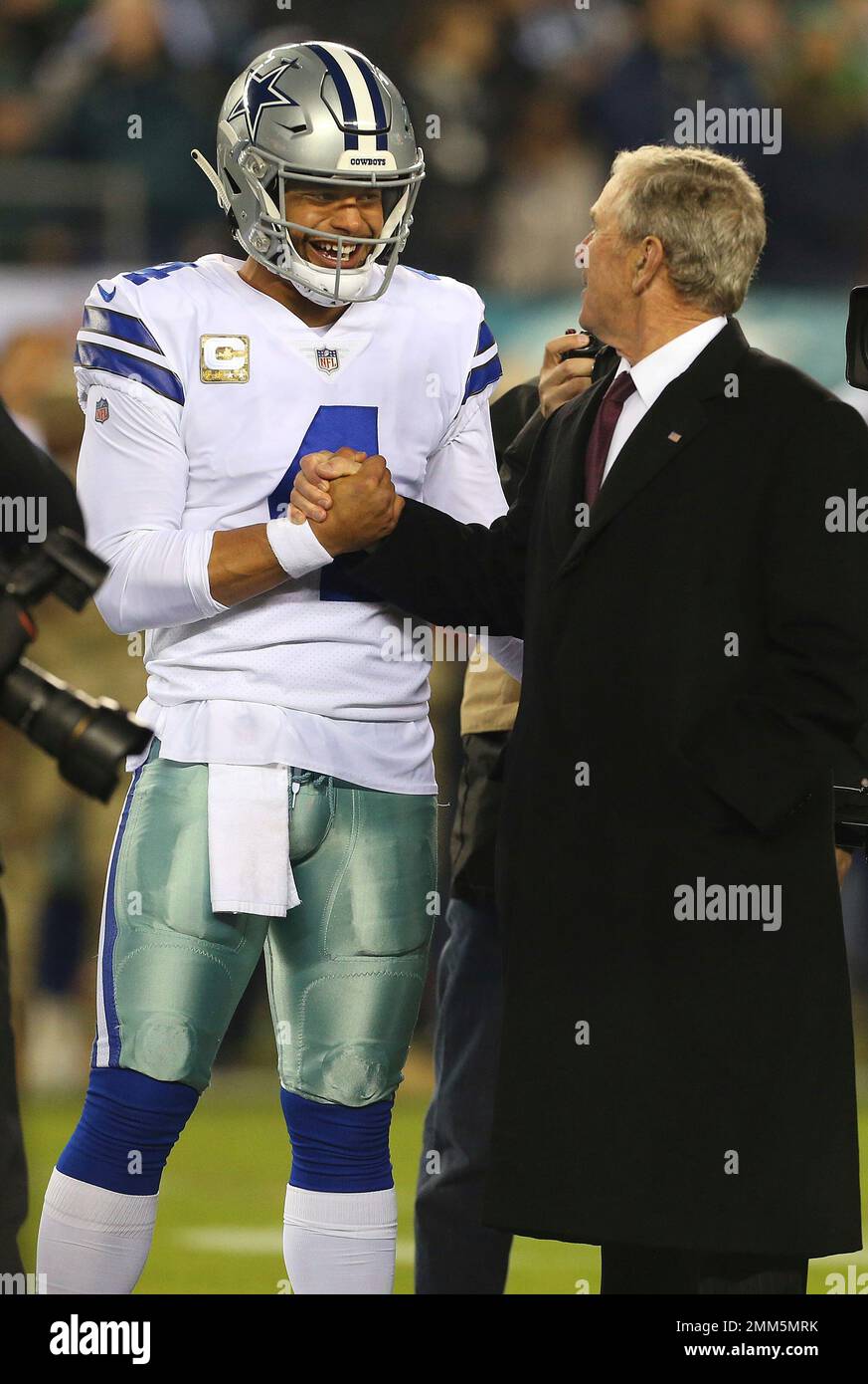 Dallas Cowboys quarterback Dak Prescott (4) shakes hands with former ...