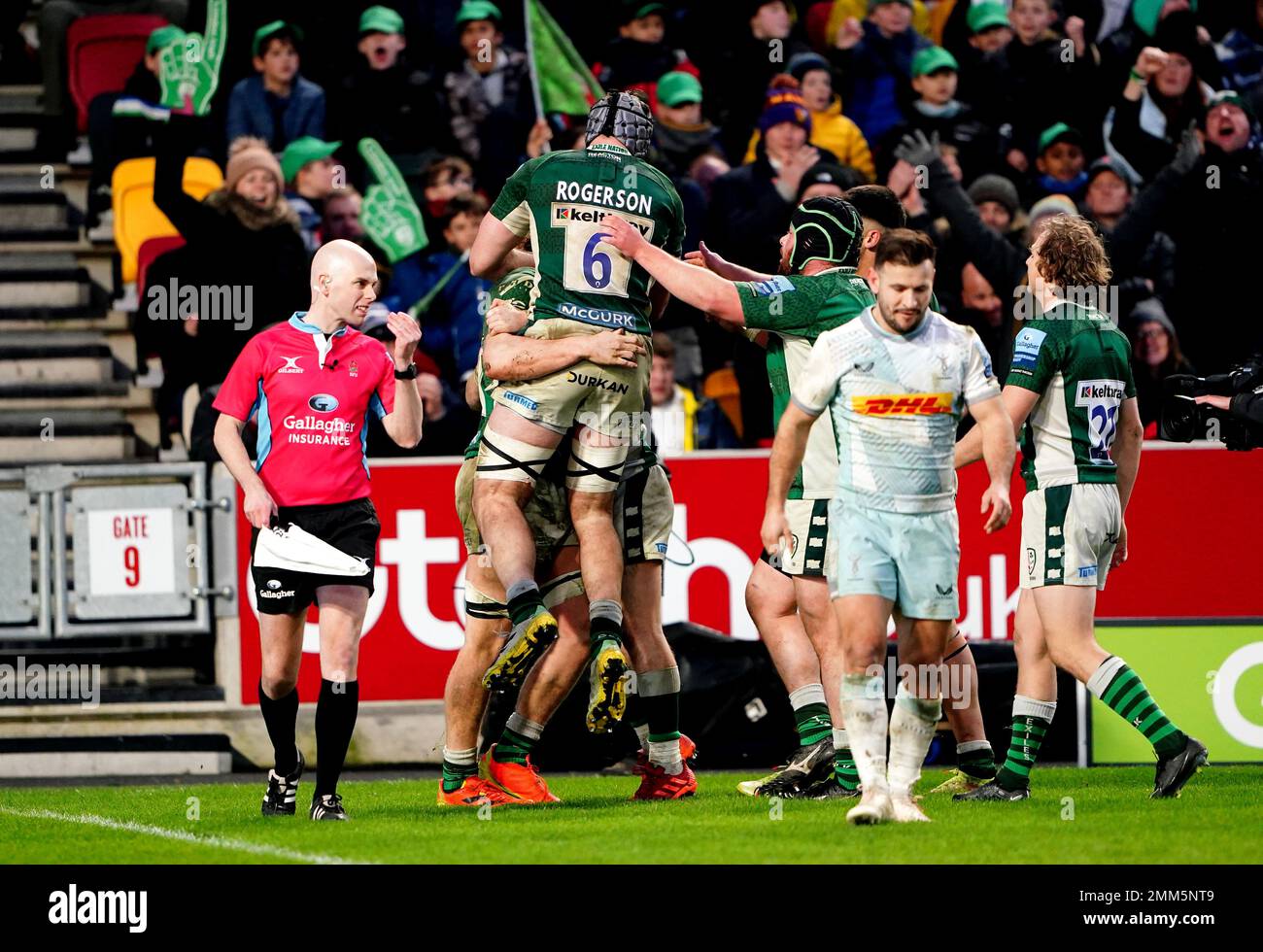 London Irish's Tom Pearson (partially blocked) celebrates with his team ...