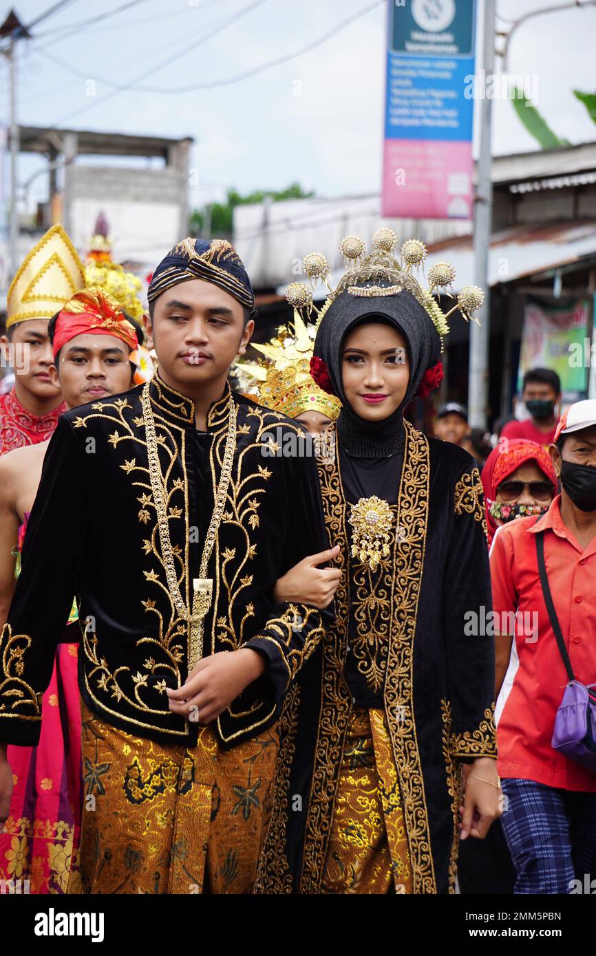 Indonesian with traditional wedding costumes at a celebration of grebeg ...
