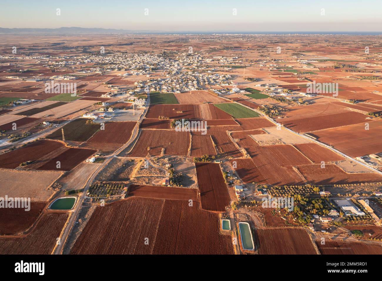 Fields with red soil and Avgorou village in Famagusta District in ...