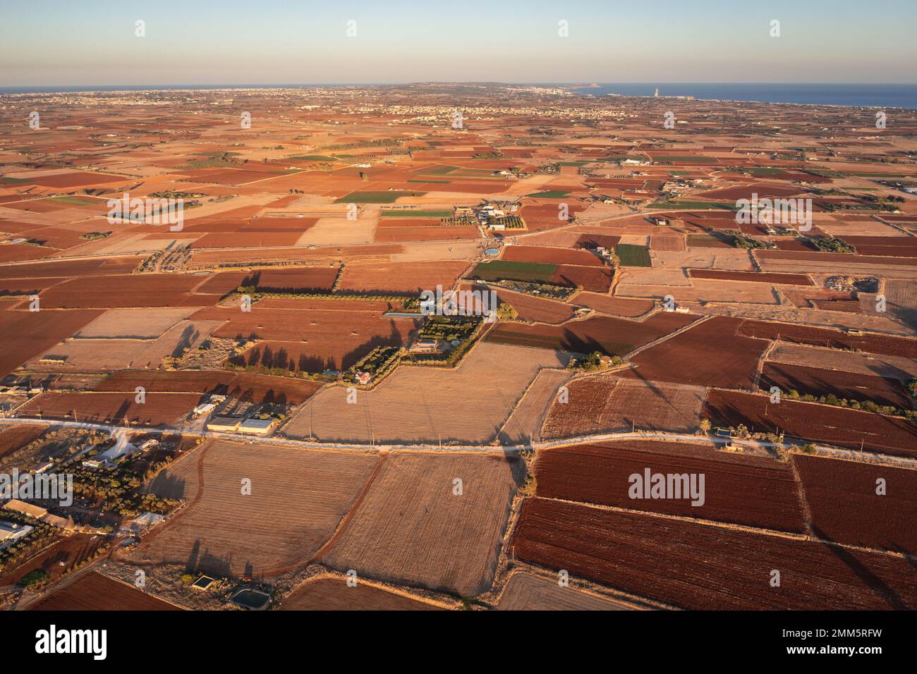 Aerial view of fields with red soil around Avgorou village in Famagusta ...