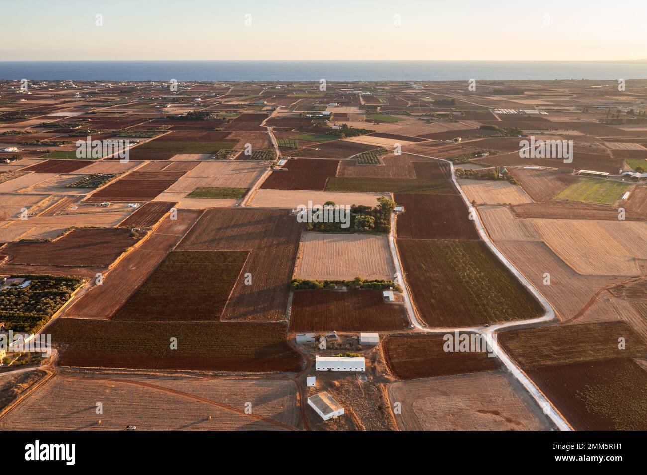 Drone view of fields with red soil around Avgorou village in Famagusta ...