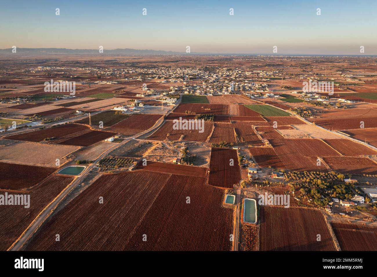 Fields with red soil and Avgorou village in Famagusta District in ...