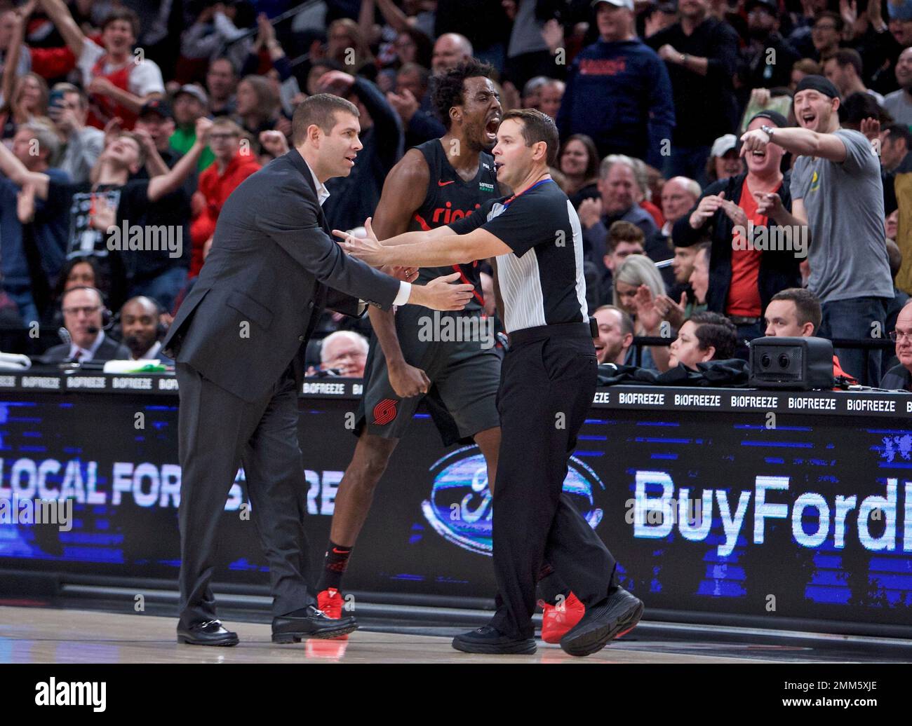 Portland Trail Blazers forward Al-Farouq Aminu, center, reacts to ...