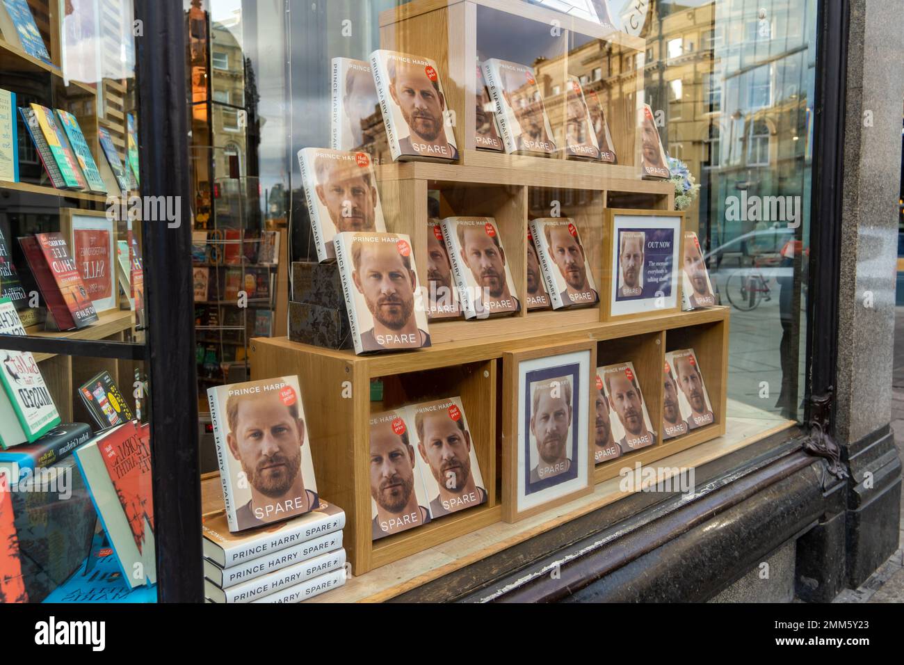 Copies of Prince Harry's book, Spare, on display in a shop window in ...
