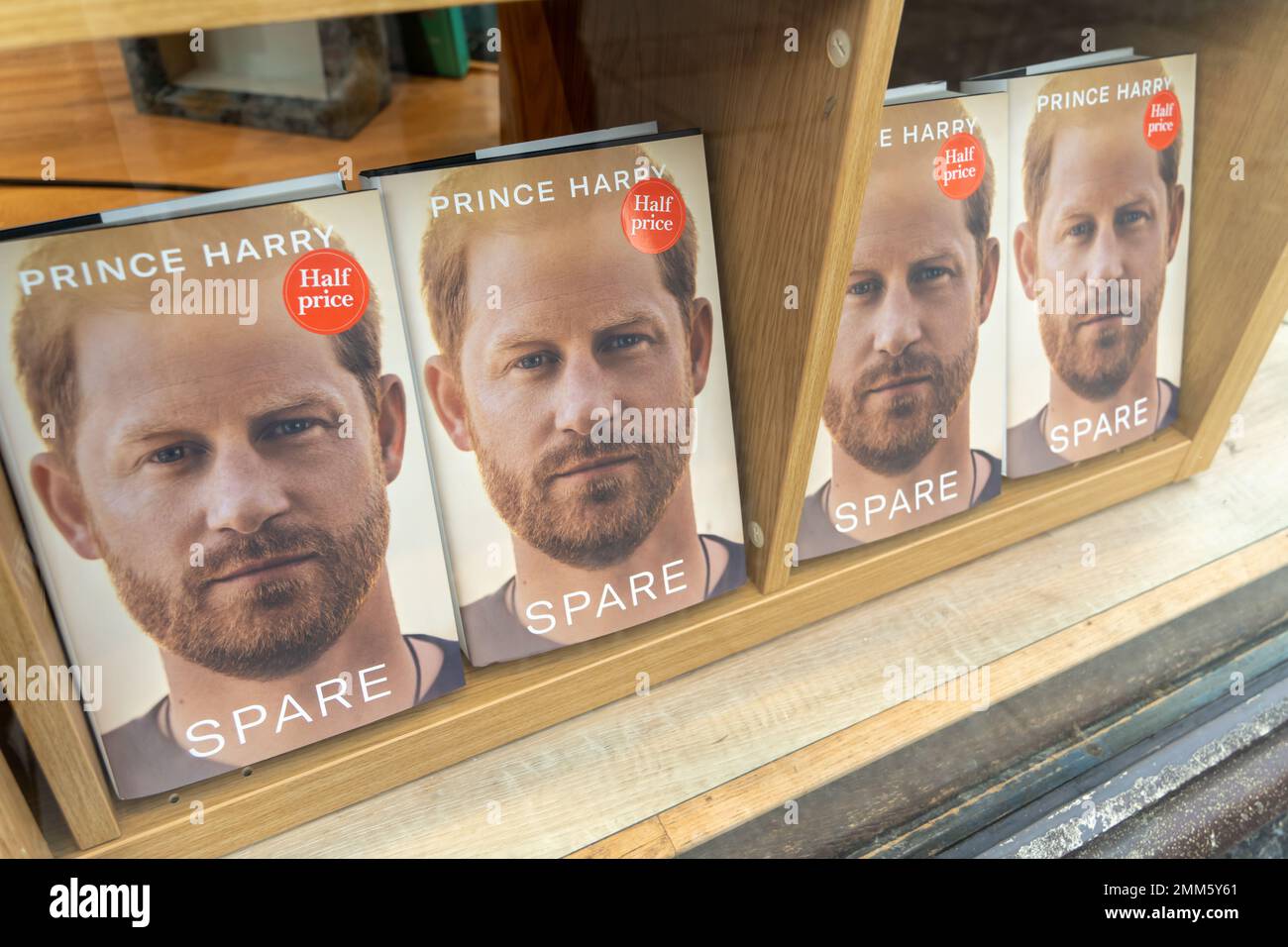 Copies of Prince Harry's book, Spare, on display in a shop window in ...