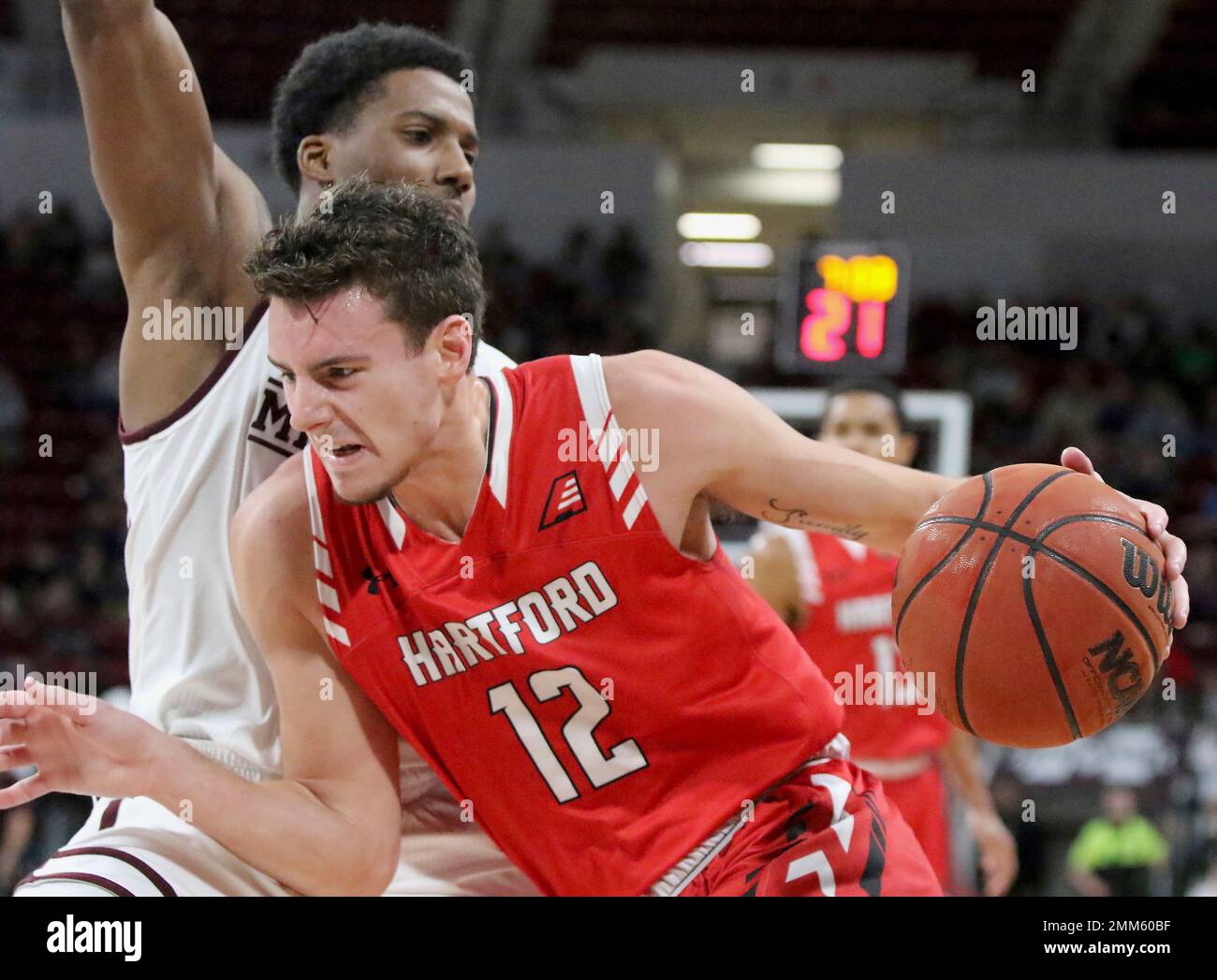 Hartford guard Jason Dunne (12) drives into Mississippi State guard ...
