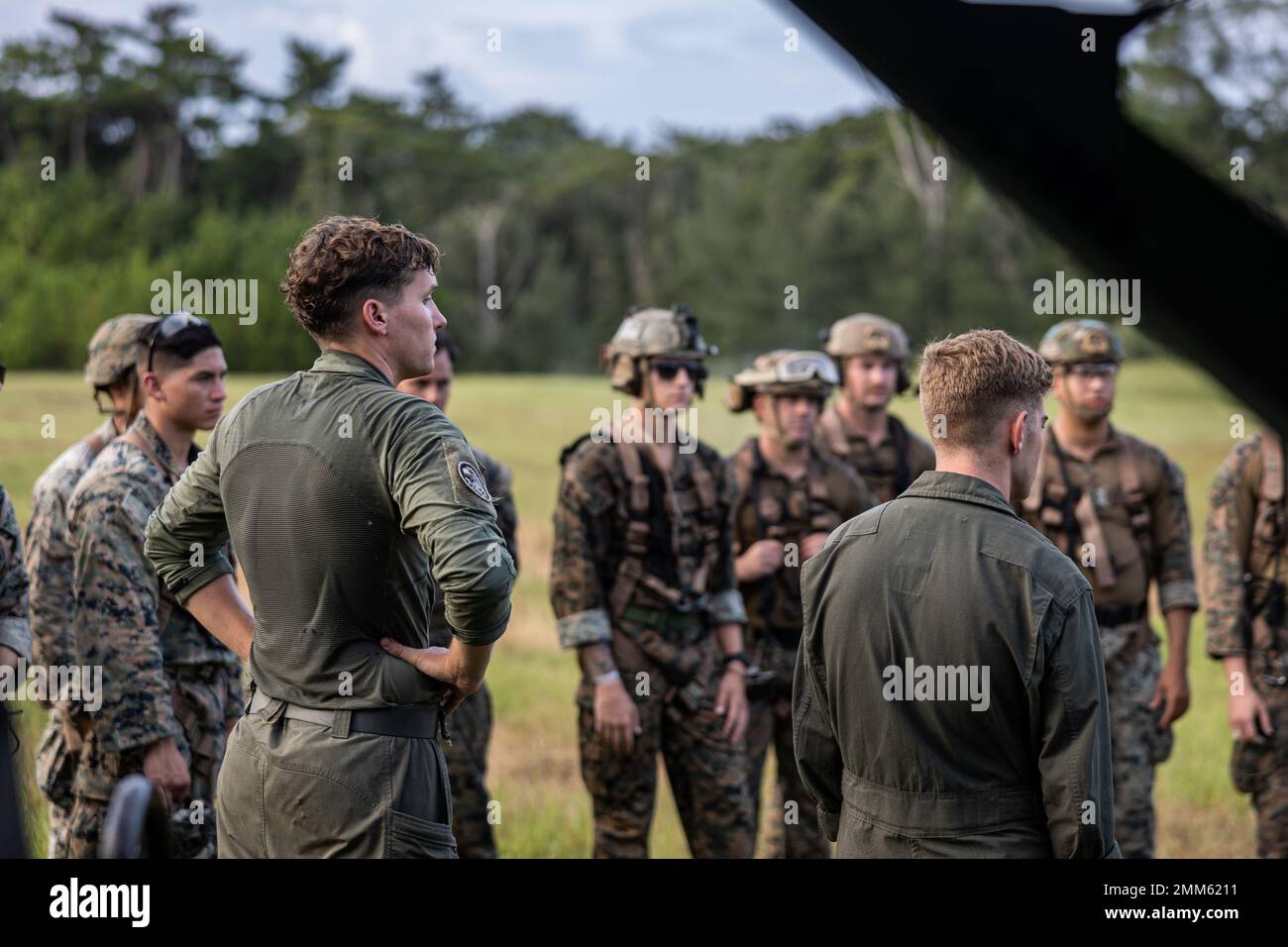U.S. Marine Corps UH-1Y Venom helicopter crew chiefs with Marine Light ...