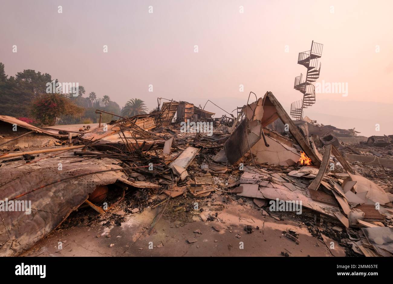 The charred remains of a burned out home are seen in Malibu, Calif ...