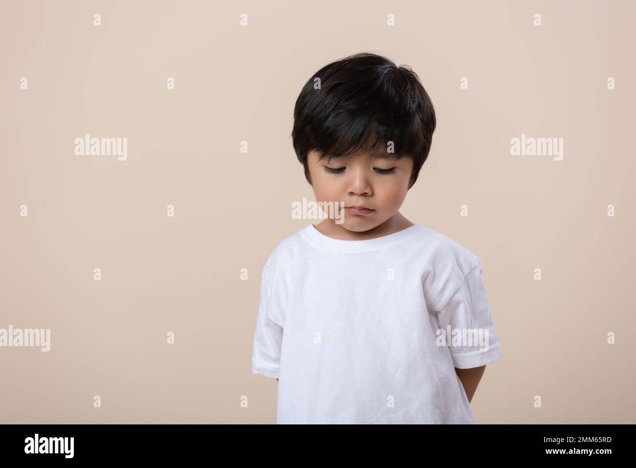 scolded or sad little Mexican boy, sad expression Stock Photo - Alamy