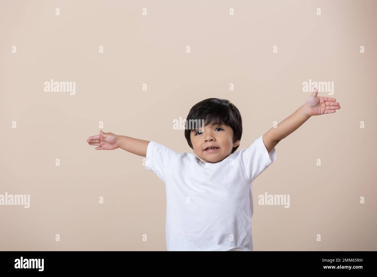 Happy Mexican little boy arms wide open Stock Photo - Alamy