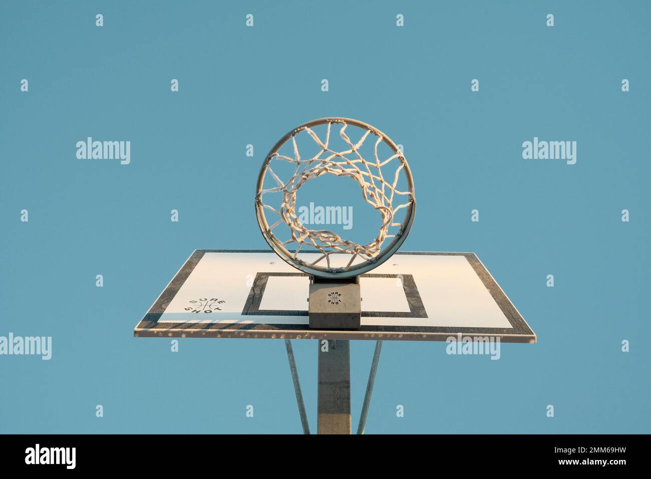 Basketball hoop with net on sports ground Stock Photo - Alamy